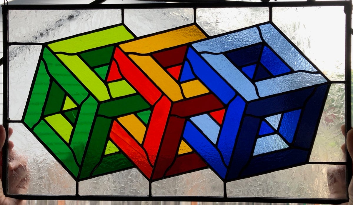 Sleater-Kinney (Three Interlinked Wireframe Cubes) | MLTSHP