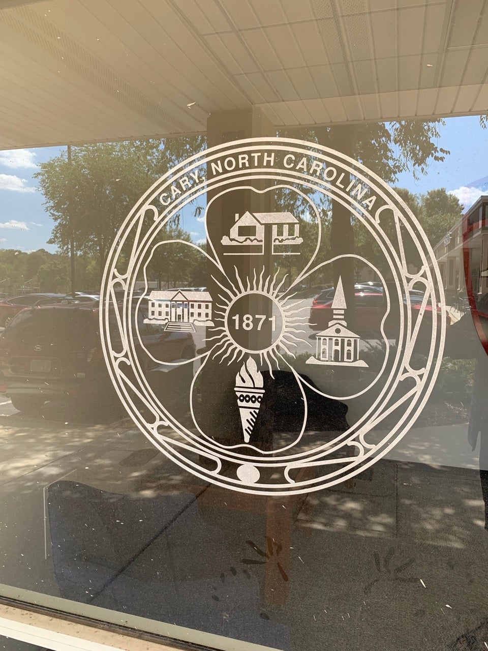 The official symbols of Cary, NC are a school, suburban house, church ...