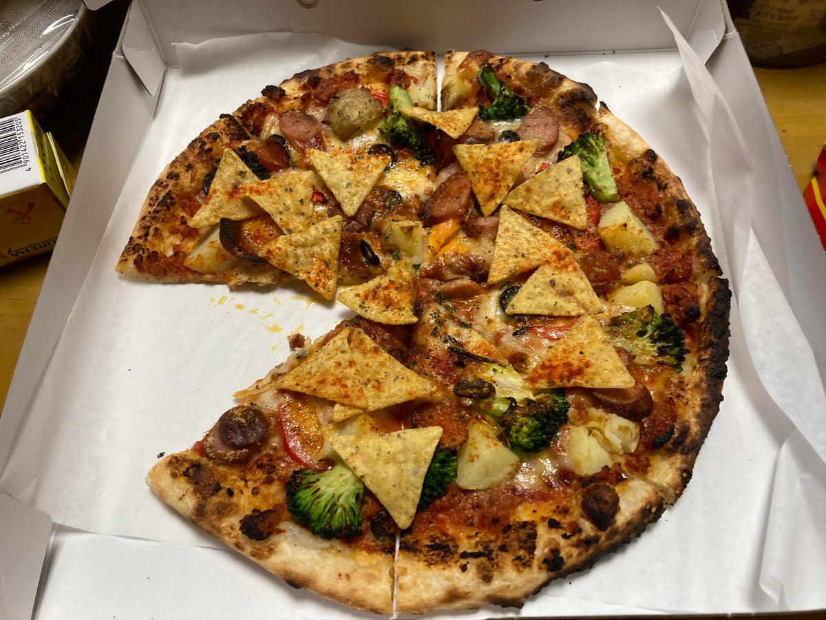 “Taco Meat” pizza with tortilla chips, potato, sausage, and broccoli toppings from a local ...