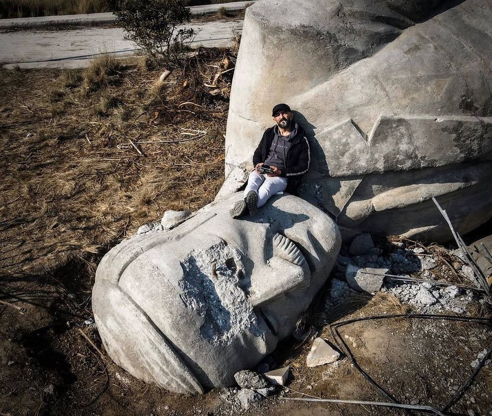 "here lies a toppled god / his fall was not a small one / we did but ...