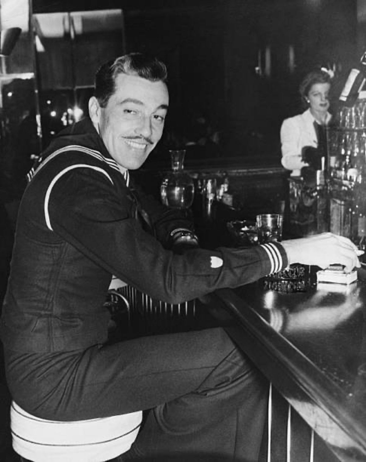 Cesar Romero in a New York bar while on shore leave from the US Coast Guard in 1943. | MLTSHP
